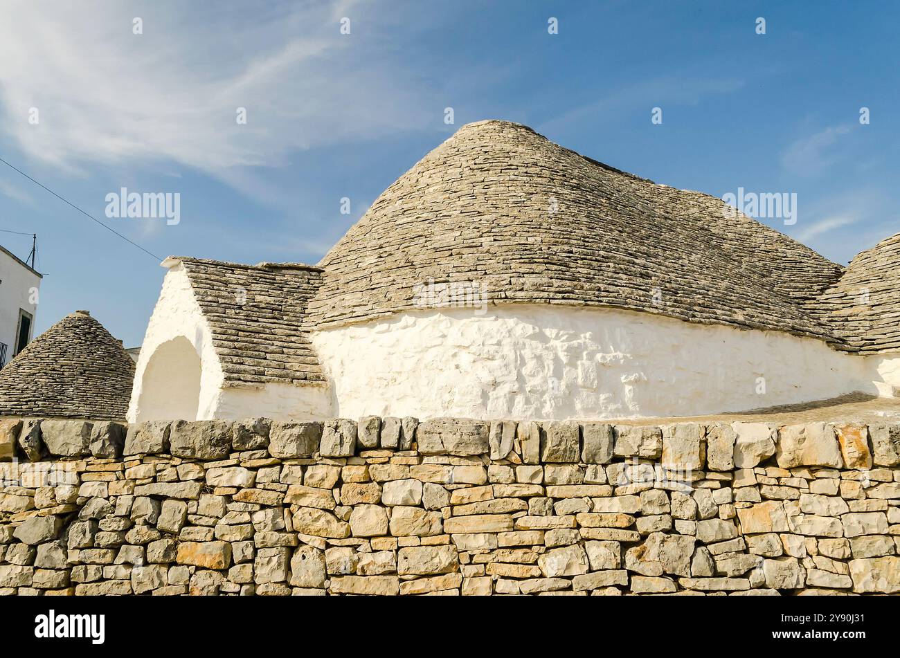 Typical trulli buildings with conical roofs in Alberobello, Apulia ...