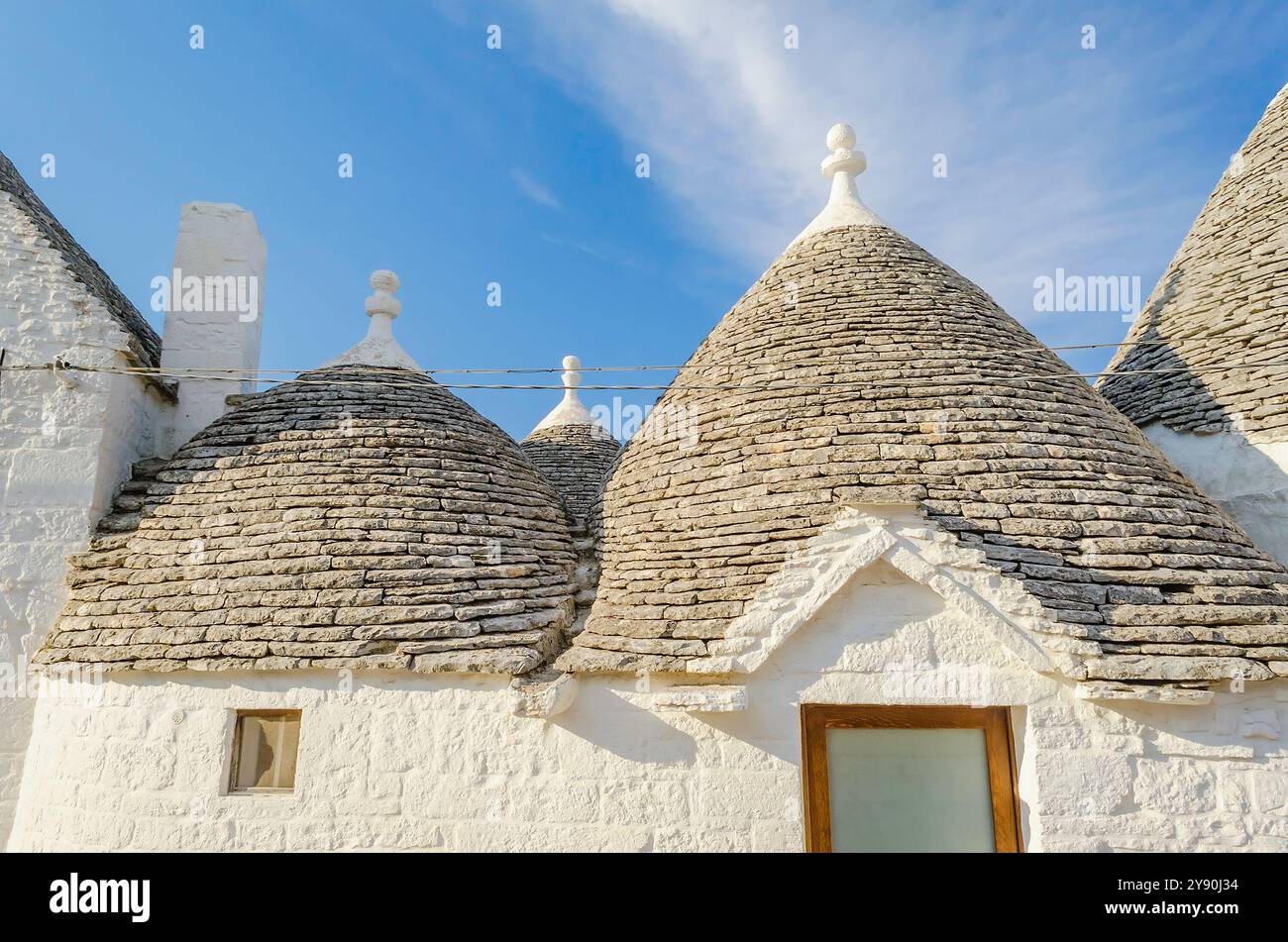 Typical trulli buildings with conical roofs in Alberobello, Apulia ...