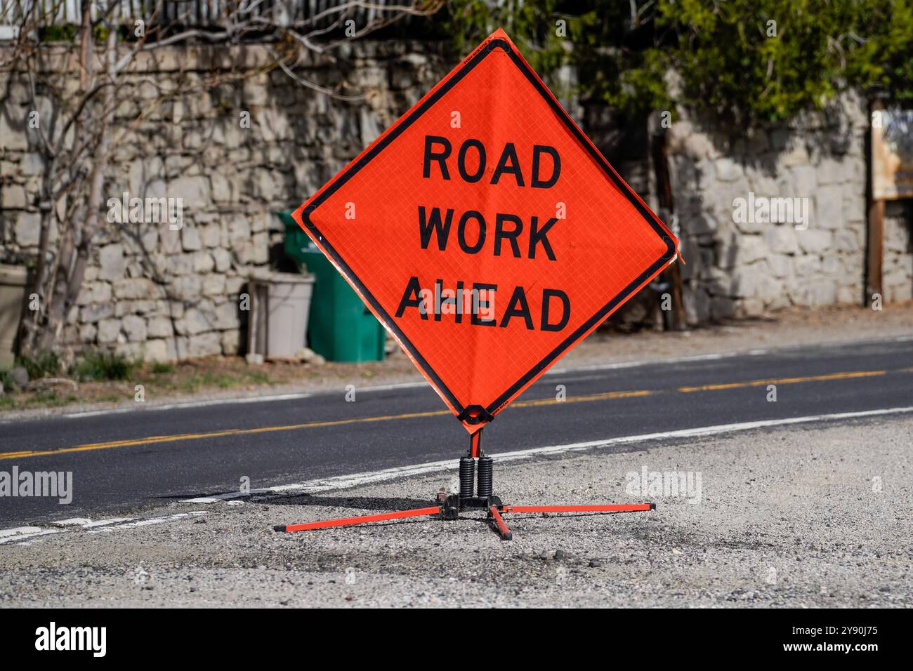 Temporary Road Work Ahead sign on side of road during the day Stock ...