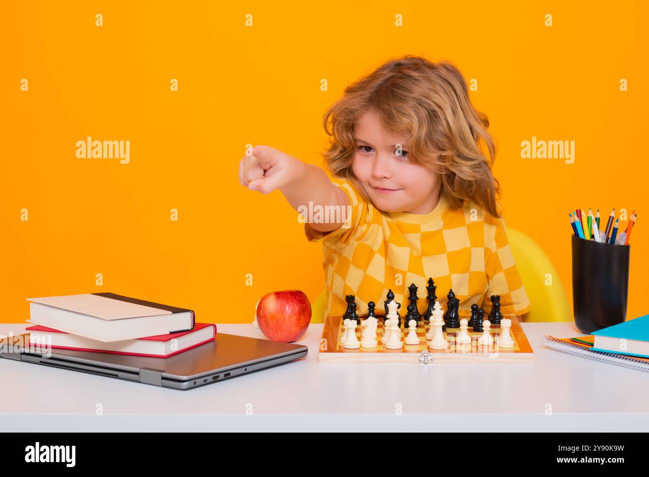 Child play chess on isolated background. Kid thinking about chess. The ...