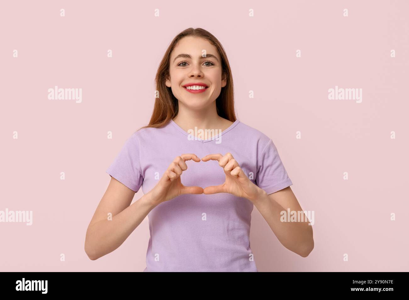 Young deaf mute woman using sign language on pink background Stock ...
