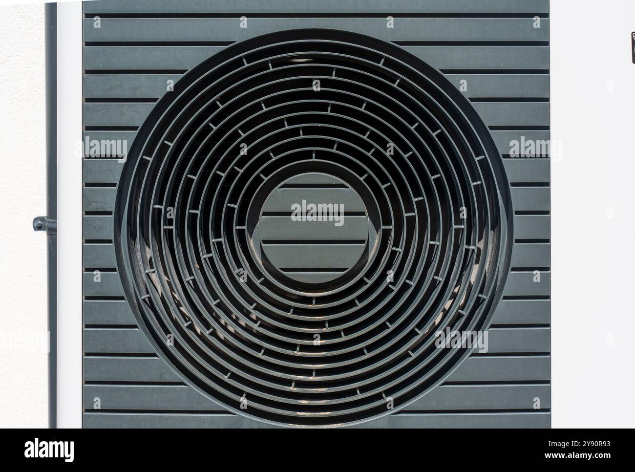 Close up of a modern air conditioner fan. Circular design with metal ...