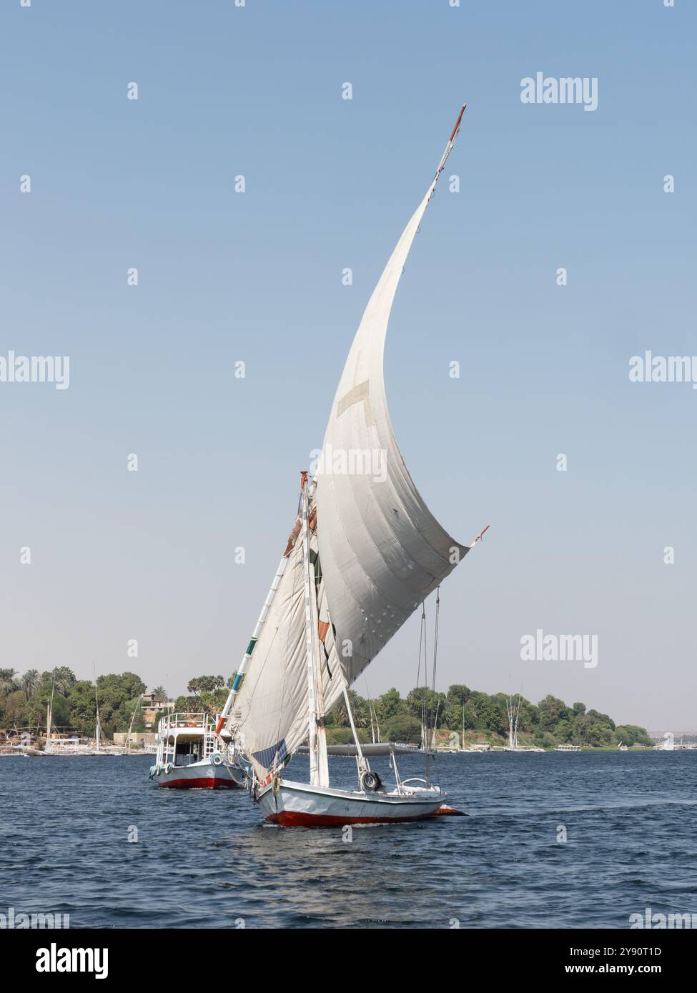 Traditional Egyptian felucca cruise sailing down the great Nile River ...