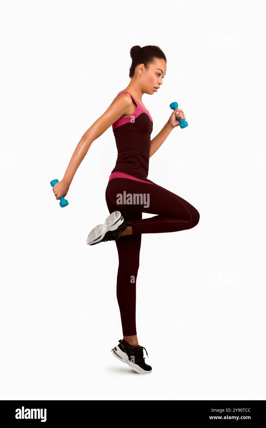 Fitness Lady Exercising Jumping With Dumbbells On White Background ...