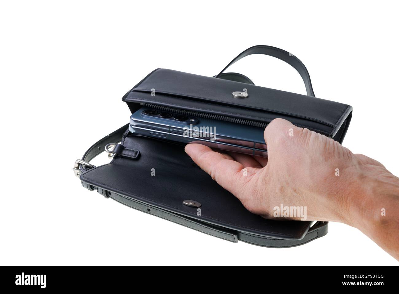 Hand person placing smartphone inside black purse isolated on white ...