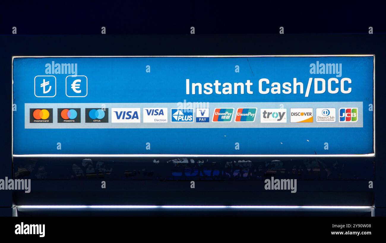 Instant Cash / DCC machine signage. The sign is filled with various ...