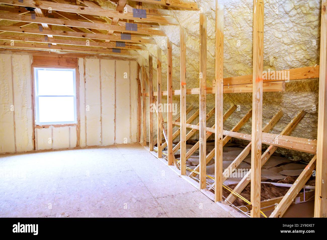 As part of construction process, thermal foam insulation is installed ...