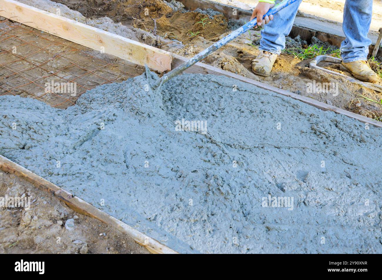 Leveling freshly poured concrete trowel hi-res stock photography and ...