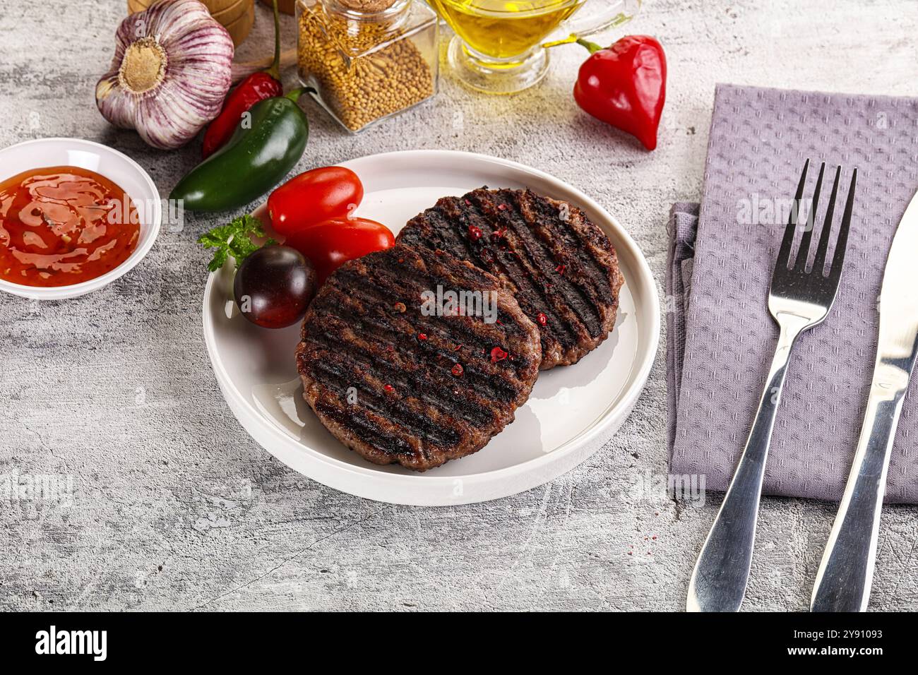 Grilled beef burger cutlet with sauce Stock Photo - Alamy