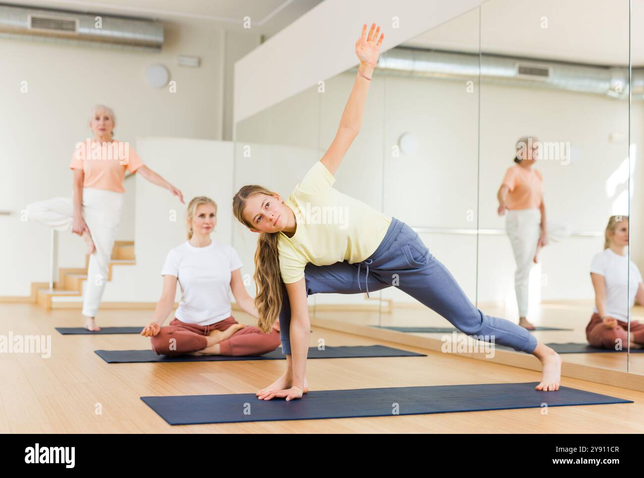 School girl training stretching workout Stock Photo - Alamy