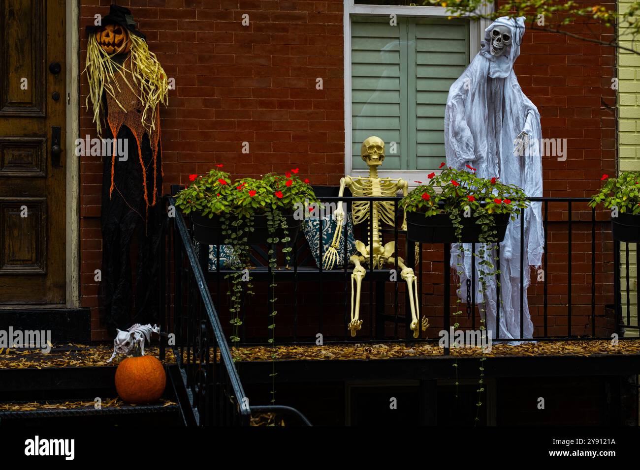 Halloween house outdoor decorations with skeleton, pumpkins and ghosts near the Halloween house ...
