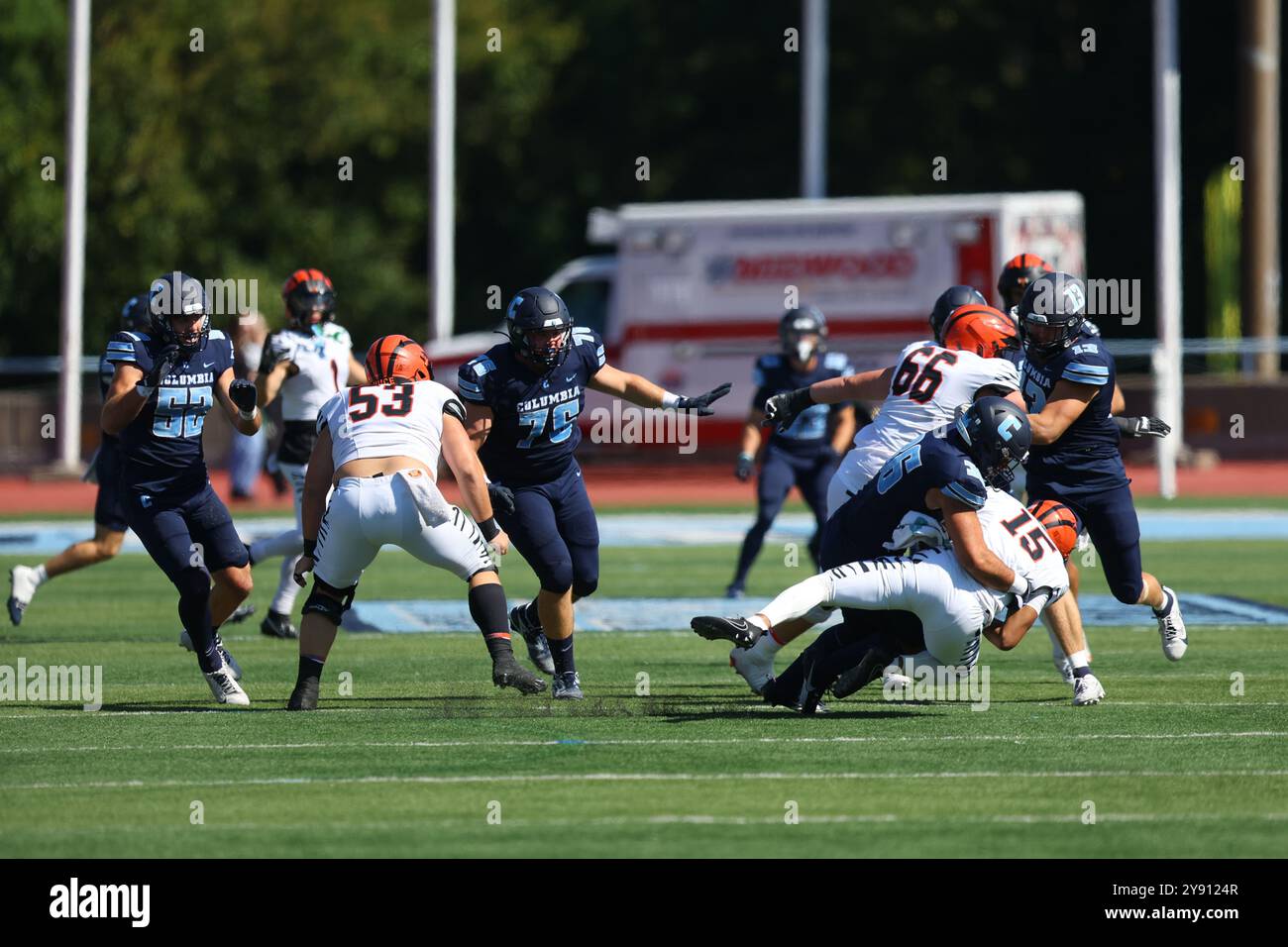 Princeton Tigers quarterback Blaine Hipa #15 is taken down by Columbia ...