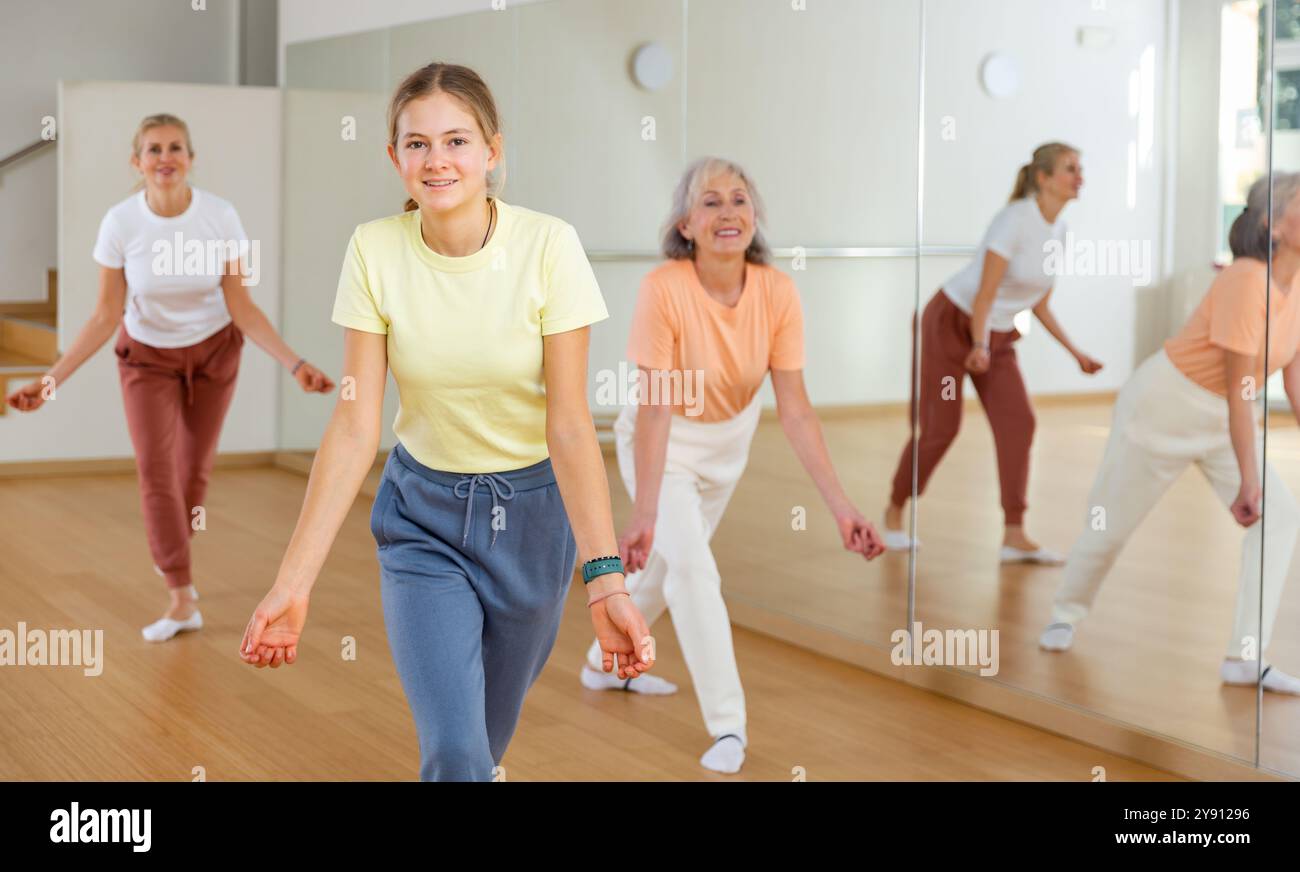 Teenage girl dancing jazz with her family in studio Stock Photo - Alamy