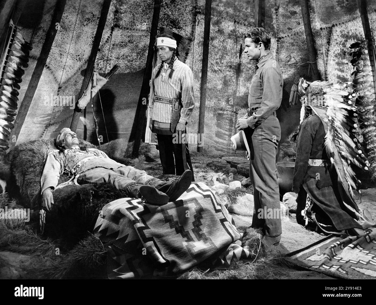 Morris Ankrum (on bed), Audie Murphy (standing right), on-set of the ...