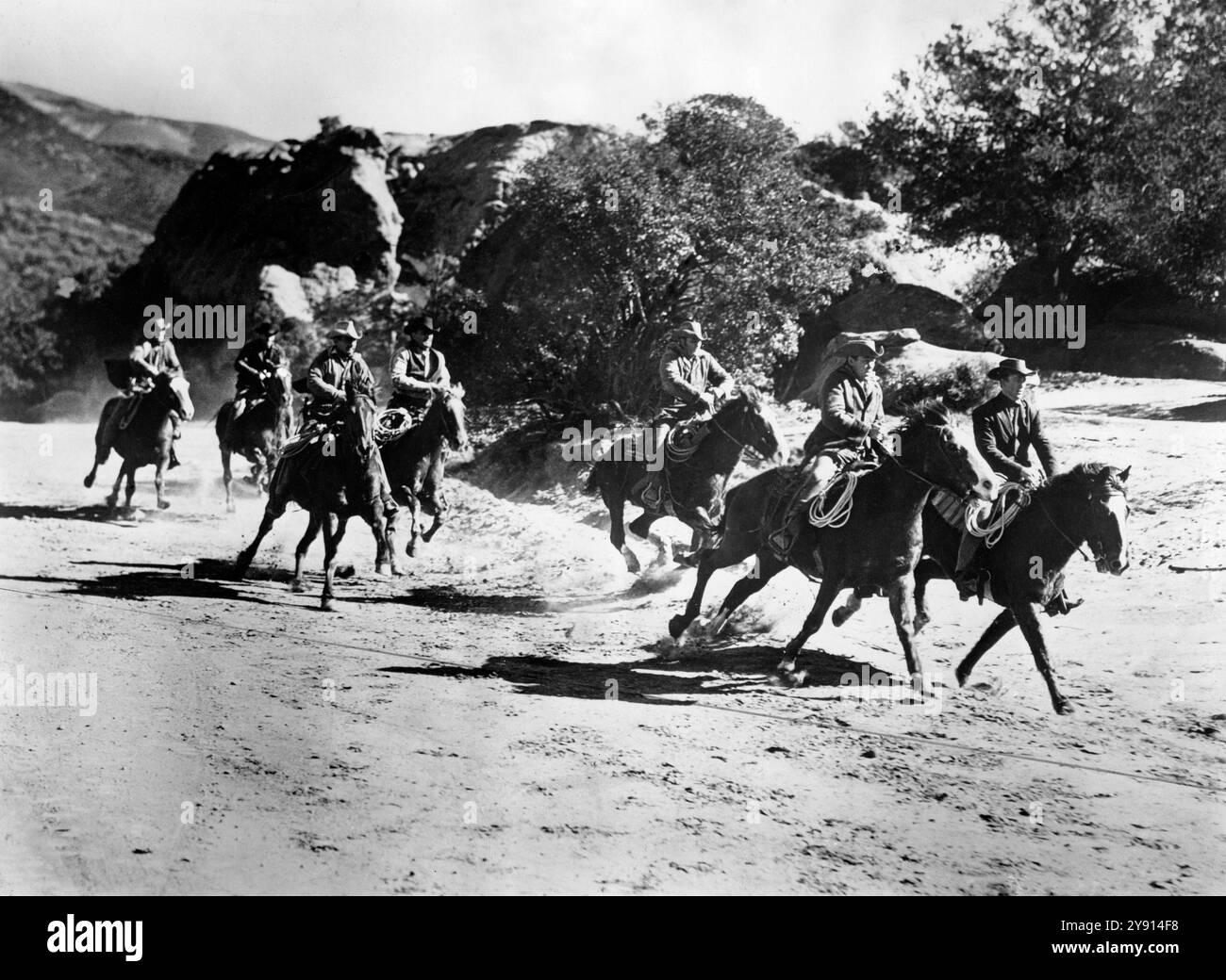 Gang of outlaws on horseback, on-set of the western film, "The Duel At ...
