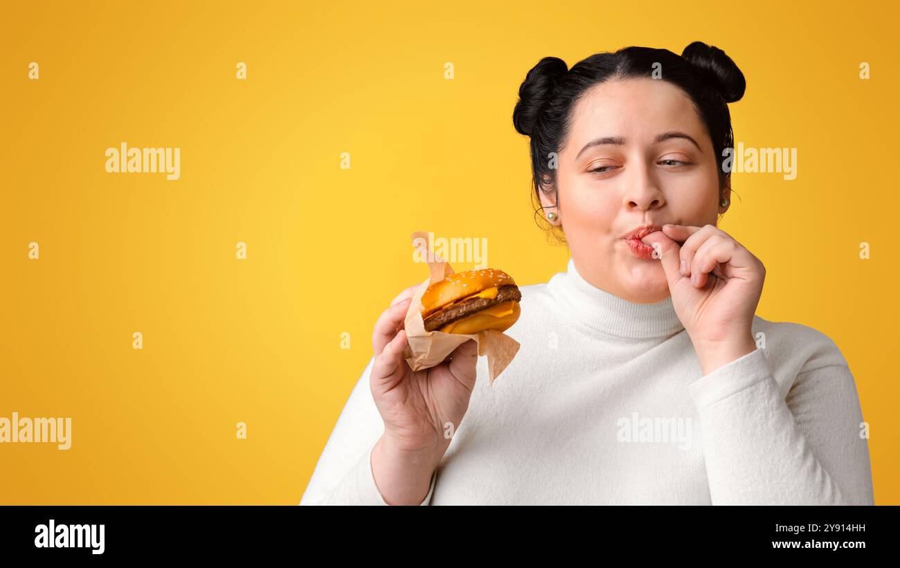 Plus Size Girl Eating Cheeseburger Sandwich And Licking Fingers With ...