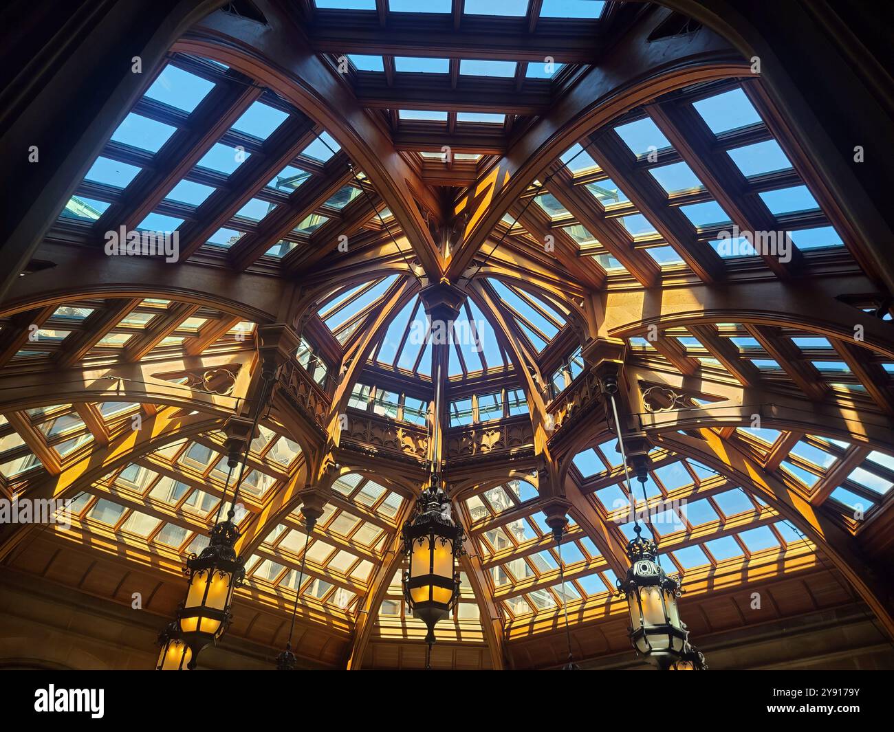 Intricate wooden ceiling with glass panels and hanging lanterns Stock ...
