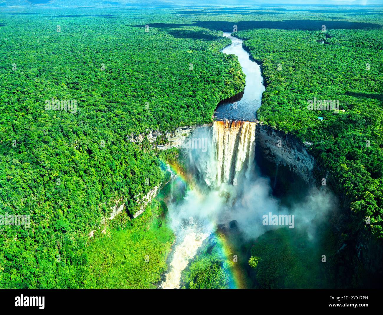 Aerial view of Kaieteur Falls with a rainbow in the Amazon rainforest ...