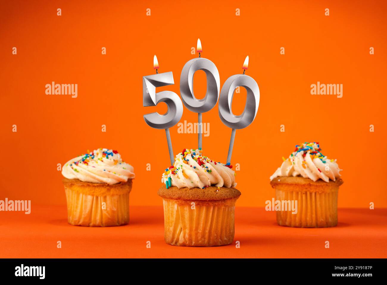 Candle number 500 - Celebration with birthday cupcake on orange ...