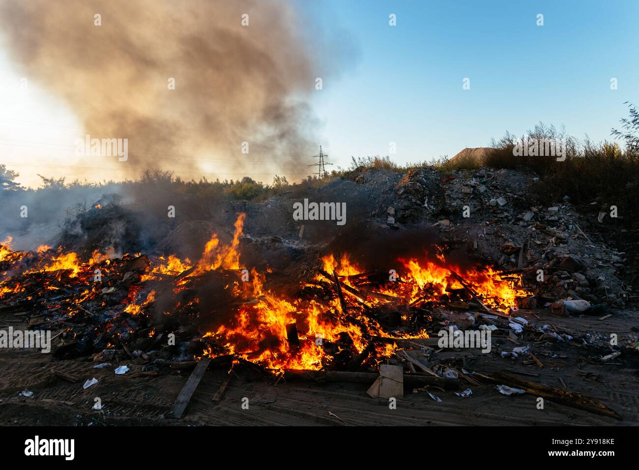 Burning garbage at landfill. Air pollution concept Stock Photo - Alamy