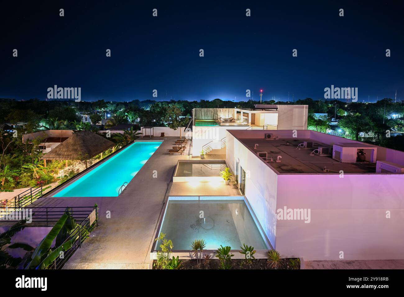 Hotel complex pool night hi-res stock photography and images - Alamy