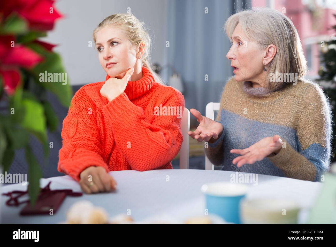 Home quarrel between mom and daughter during christmas closeup Stock ...