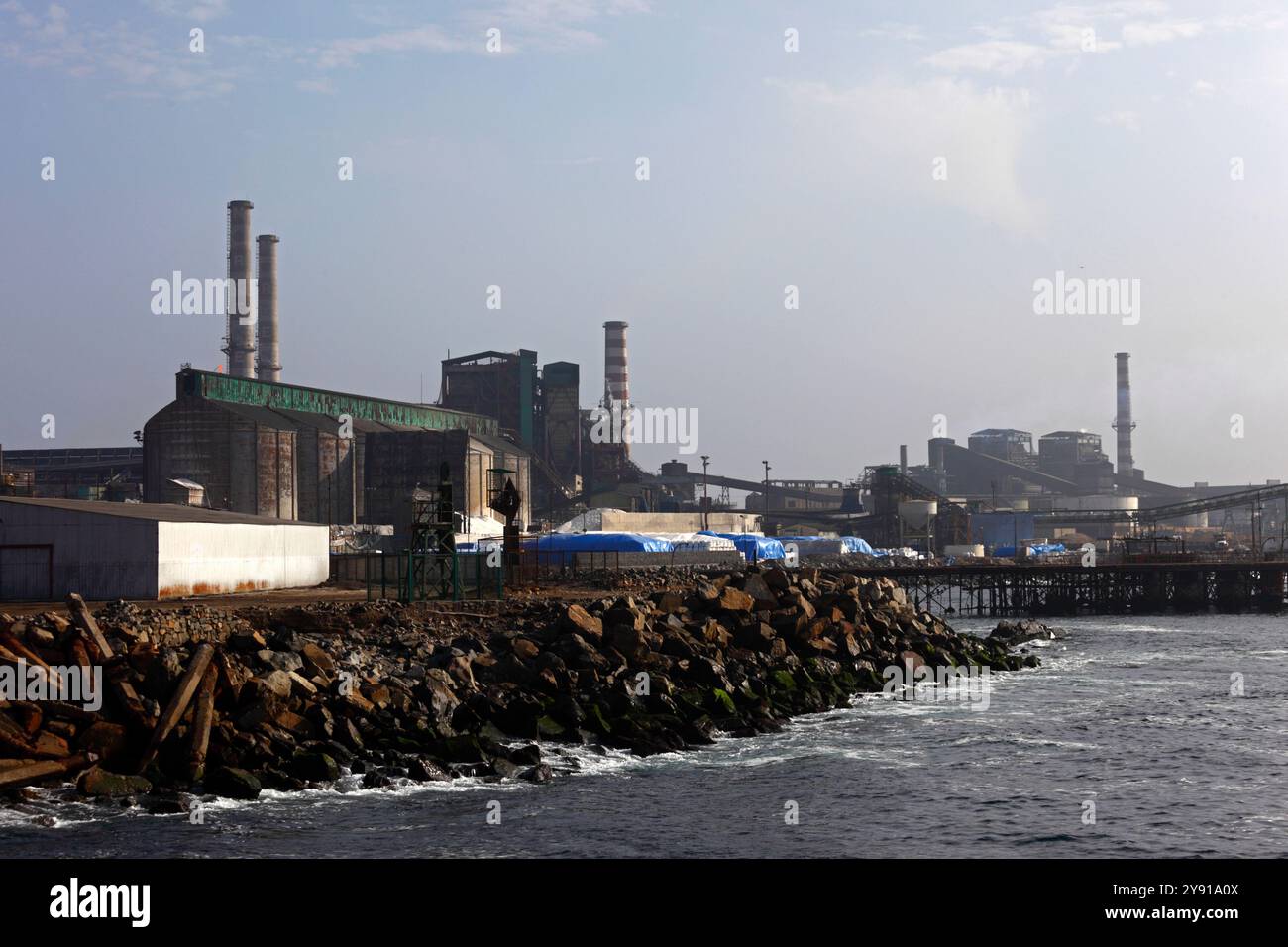 View of the thermoelectric power plant and rocky revetments along ...