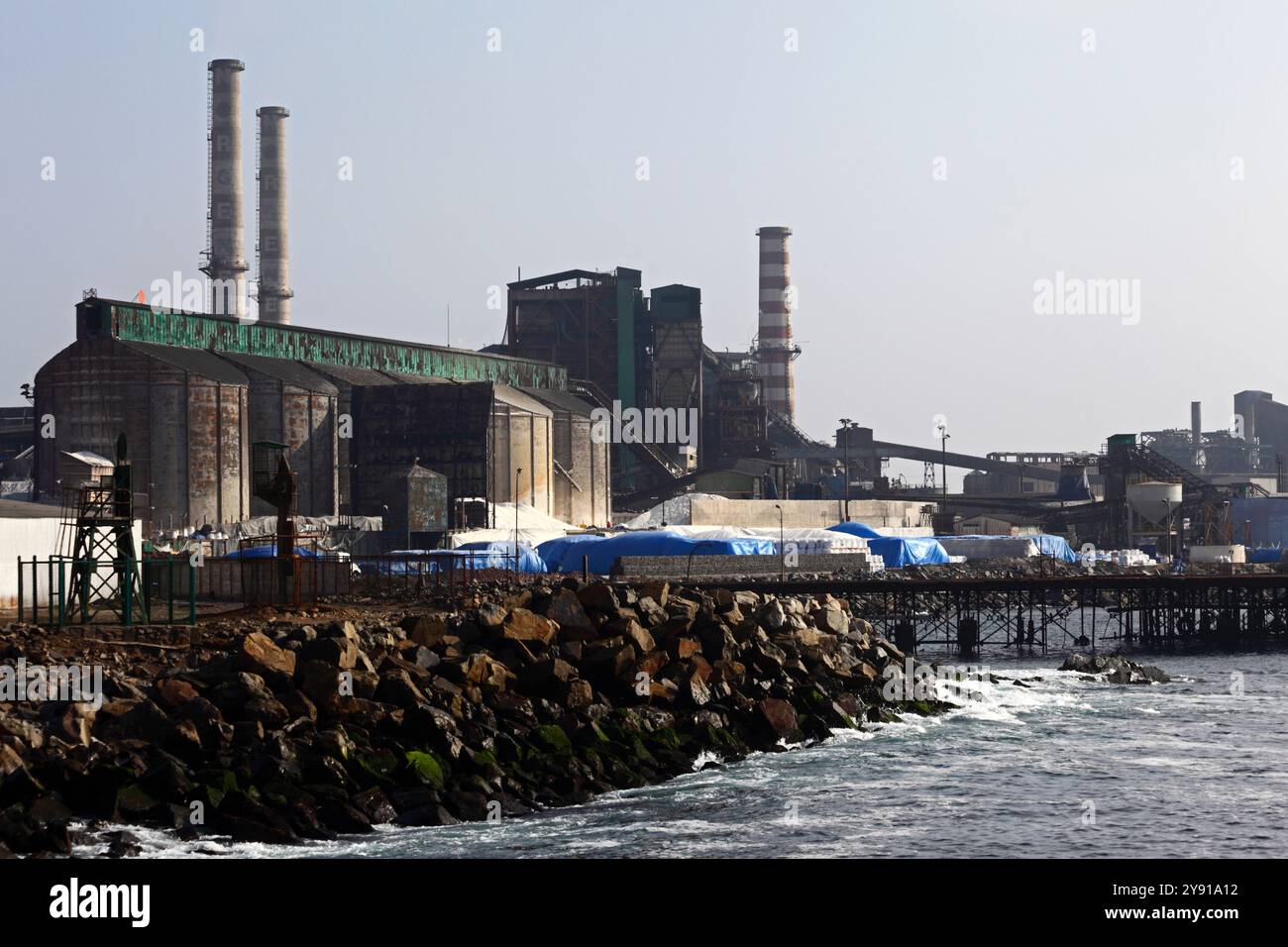 View of the thermoelectric power plant and rocky revetments along ...