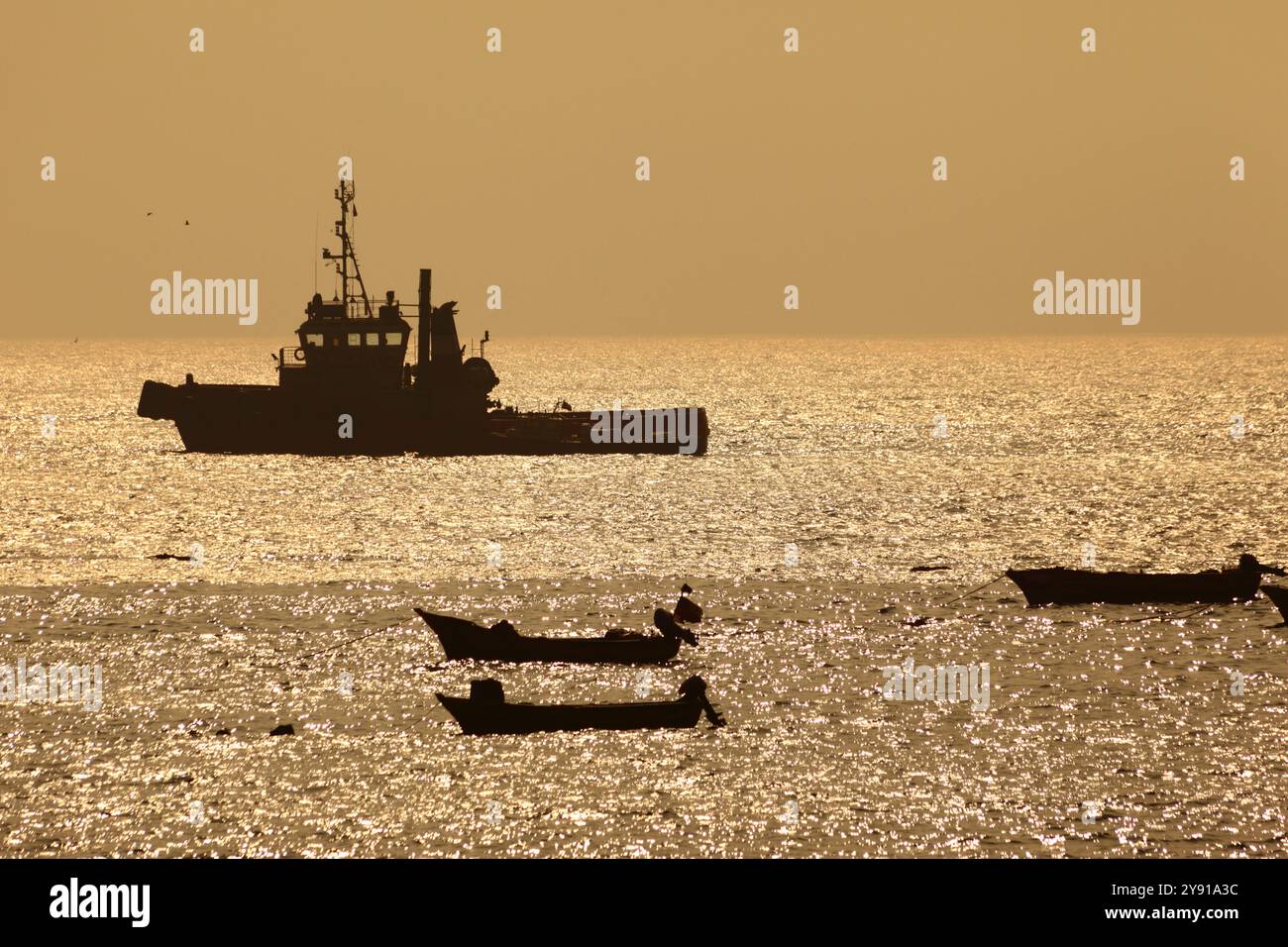 Tugboat and fishing boats moored in Pacific Ocean off the port of ...