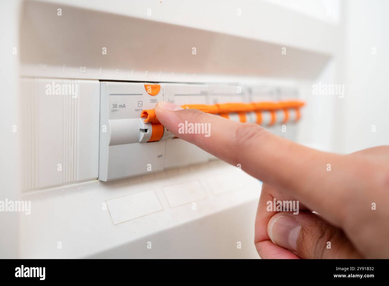 Close up of man hand and electrician with electricity fuse box, check ...