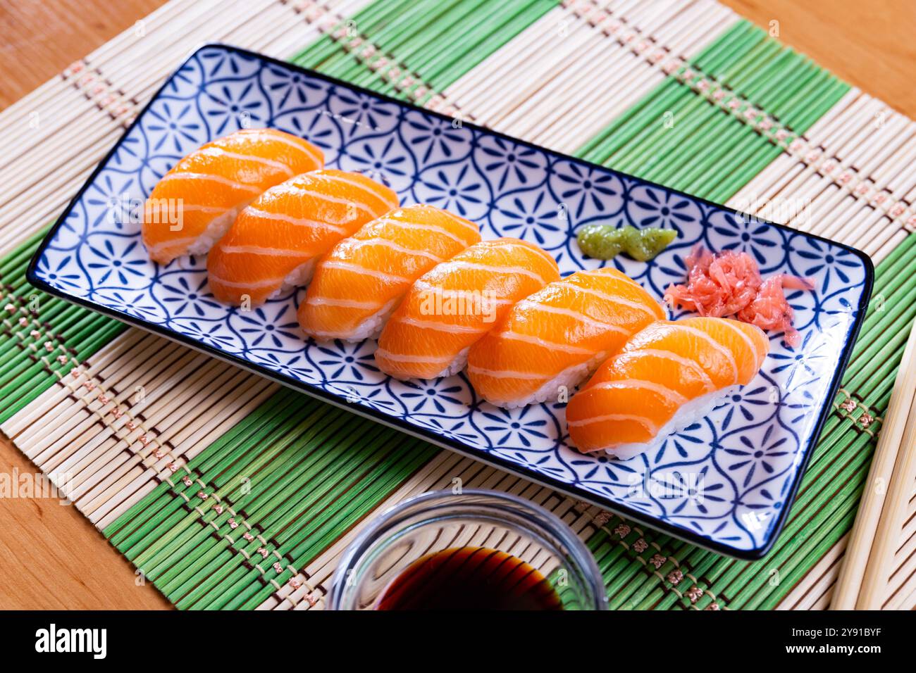 Sake Nigiri served in a plate with soya sauce Stock Photo - Alamy