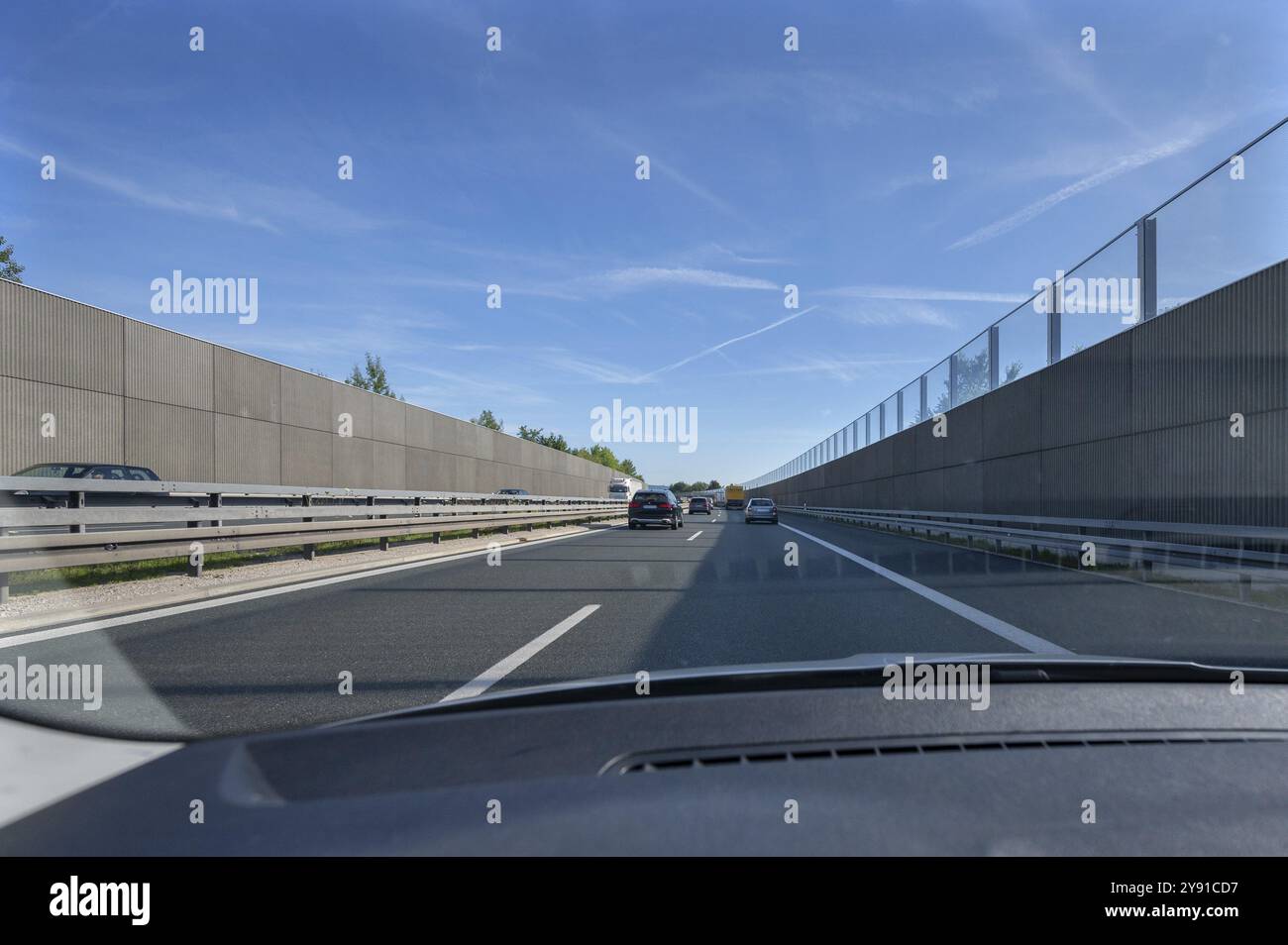Driving on the A73 motorway with noise barriers on both sides, Bavaria ...