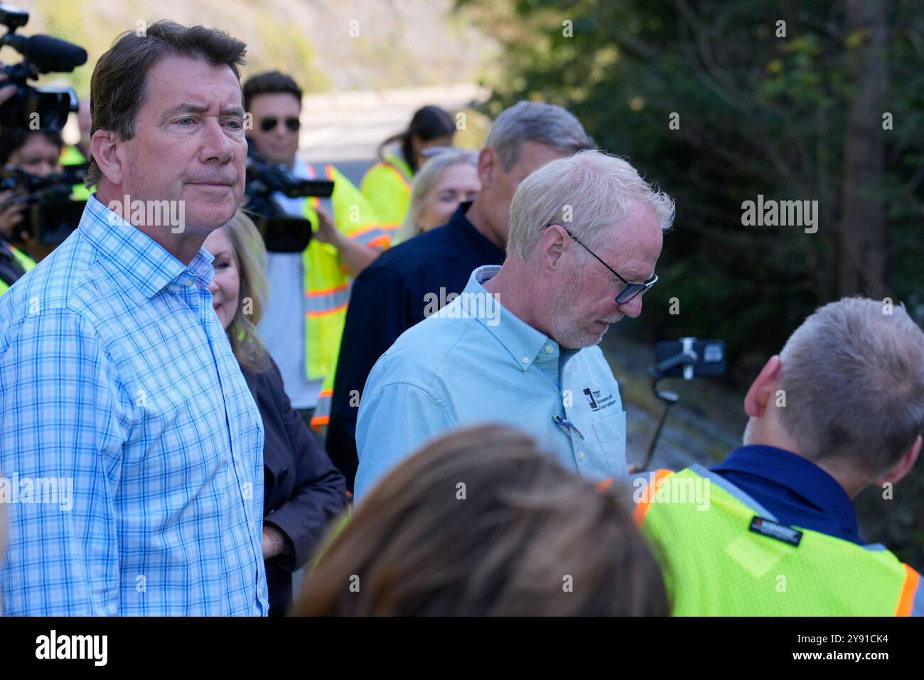 Sen. Bill Hagerty, R-Tenn., left, surveys the damage from Hurricane ...