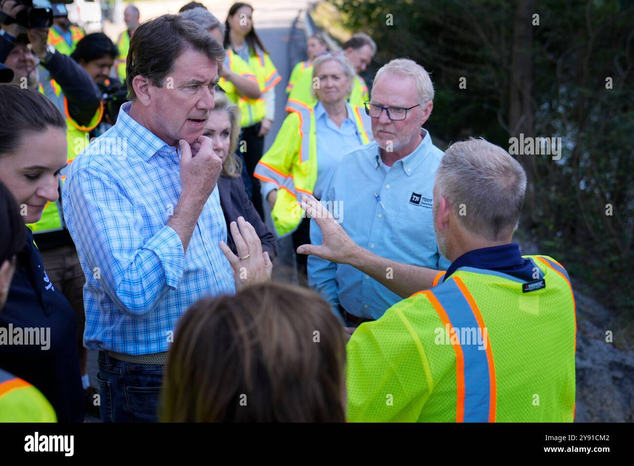 Sen. Bill Hagerty, R-Tenn., left, surveys the damage from Hurricane ...