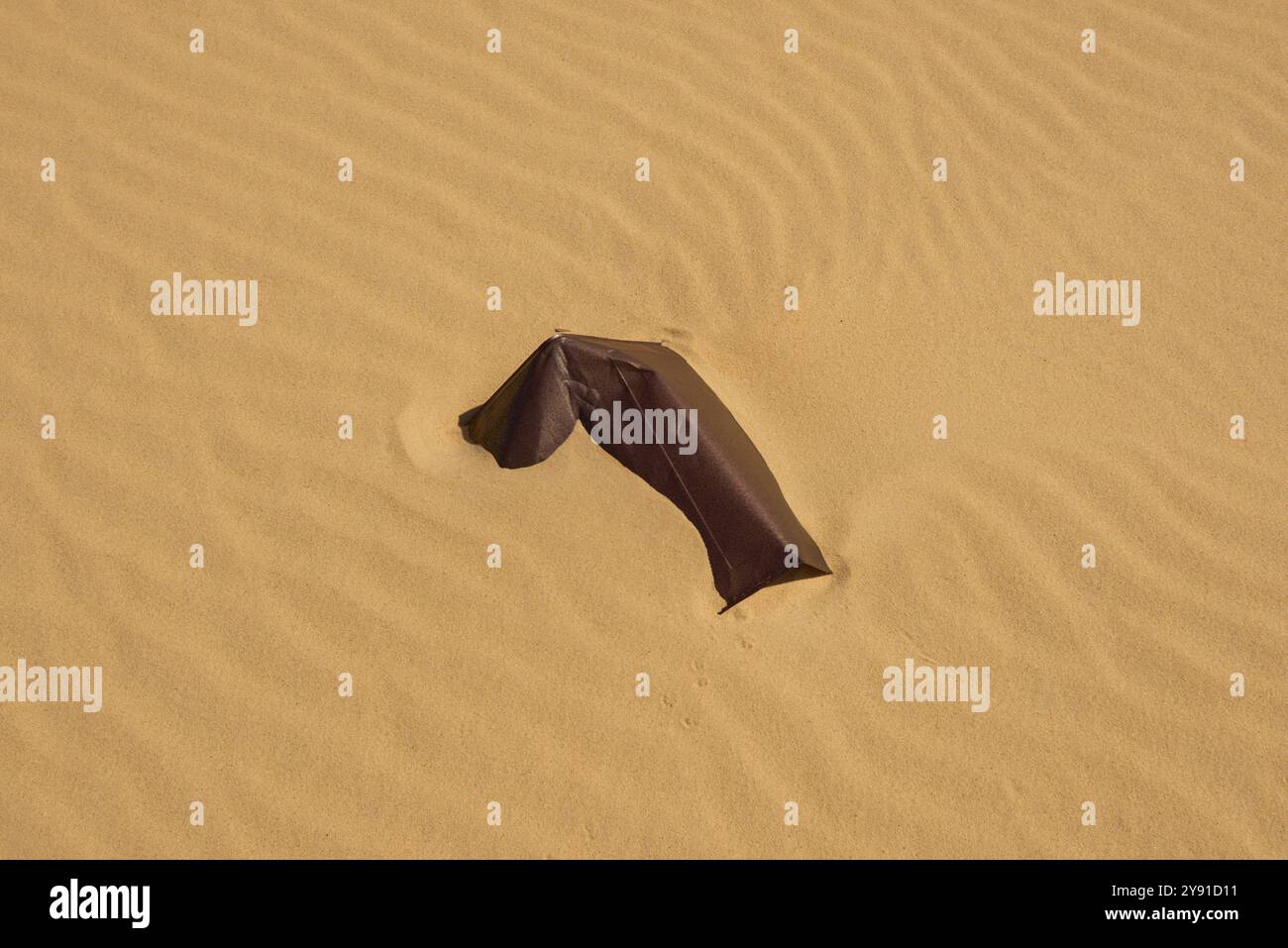 Sheet metal fragment on a sandy surface in the desert, Matruh, Great ...