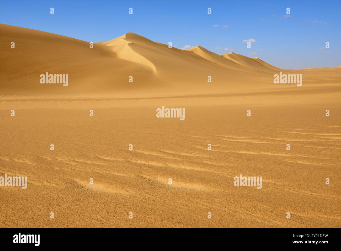 Endless sand dunes under a clear blue sky with few clouds, Matruh ...