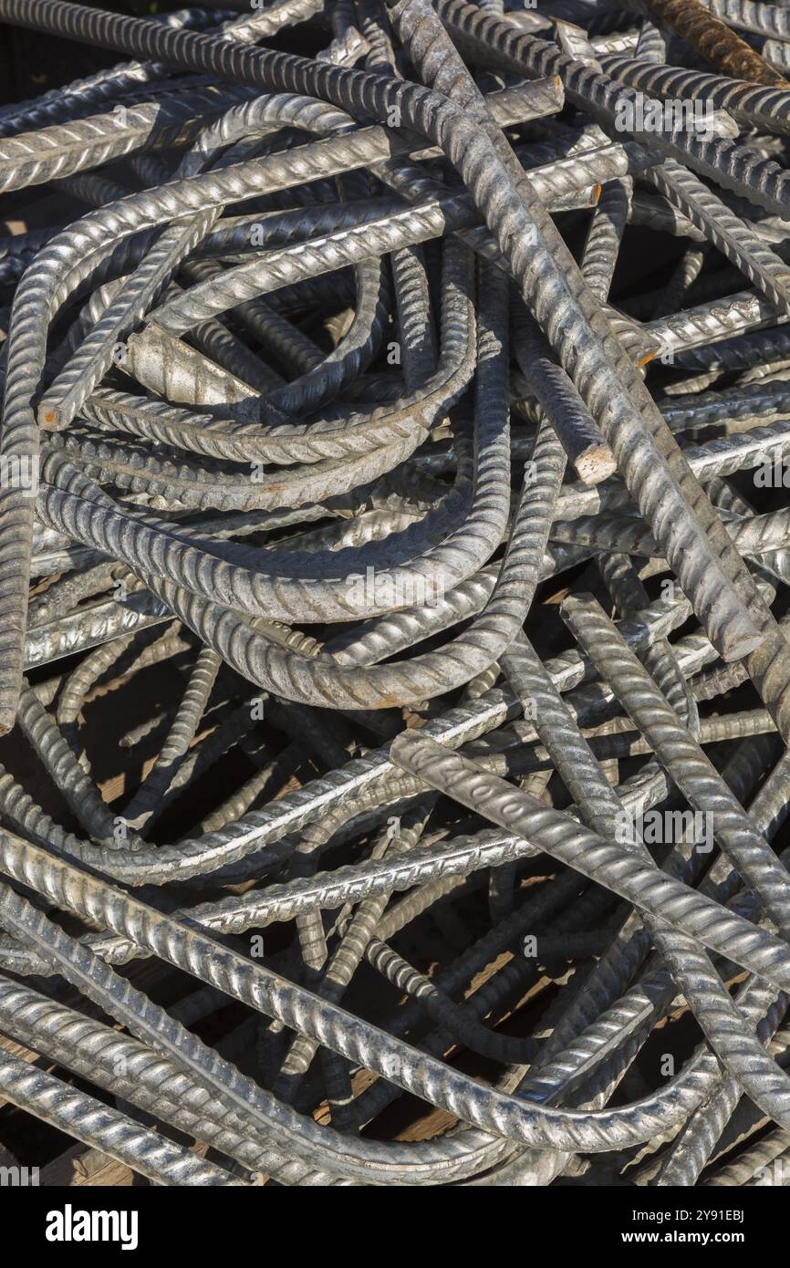 Pile of construction grade steel rods in metal recycling yard, Quebec ...