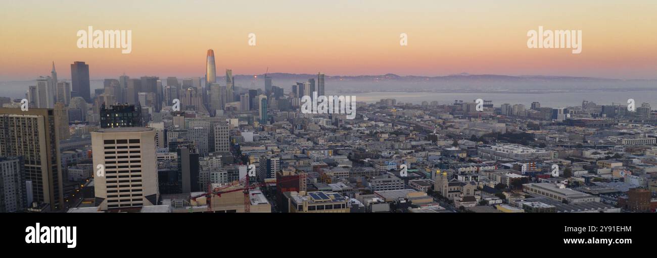 Orange hues seem to bounce off the tallest building as night comes to ...