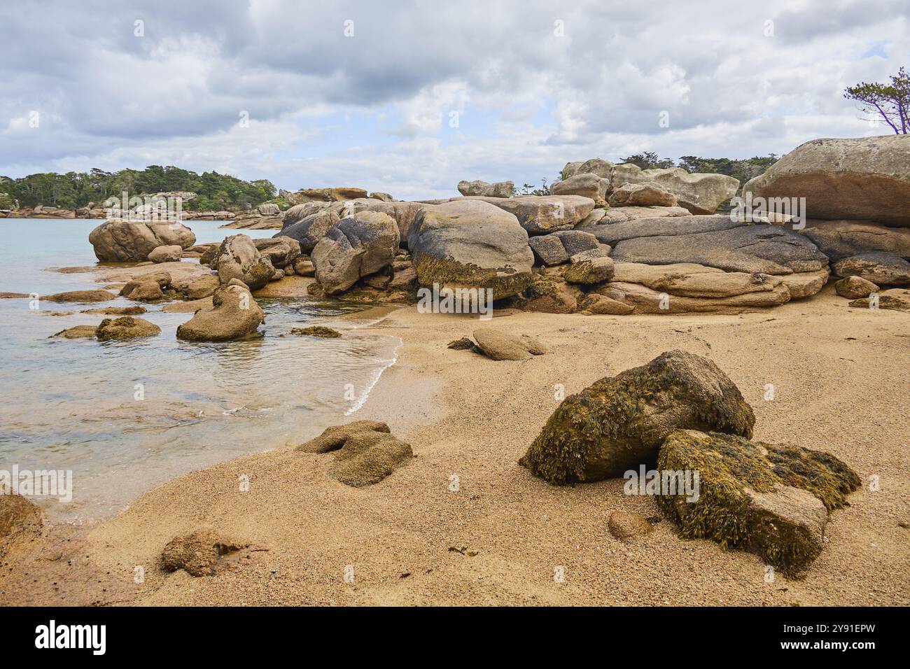 Light-coloured sand and round granite rocks, Plage de Tourony, Tournoy ...