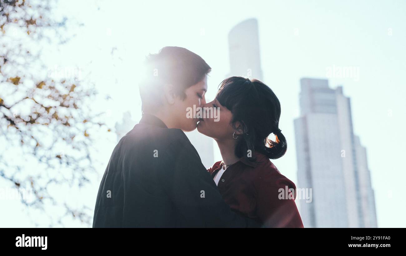 Close-up of the tender kiss shared between two young women Stock Photo ...