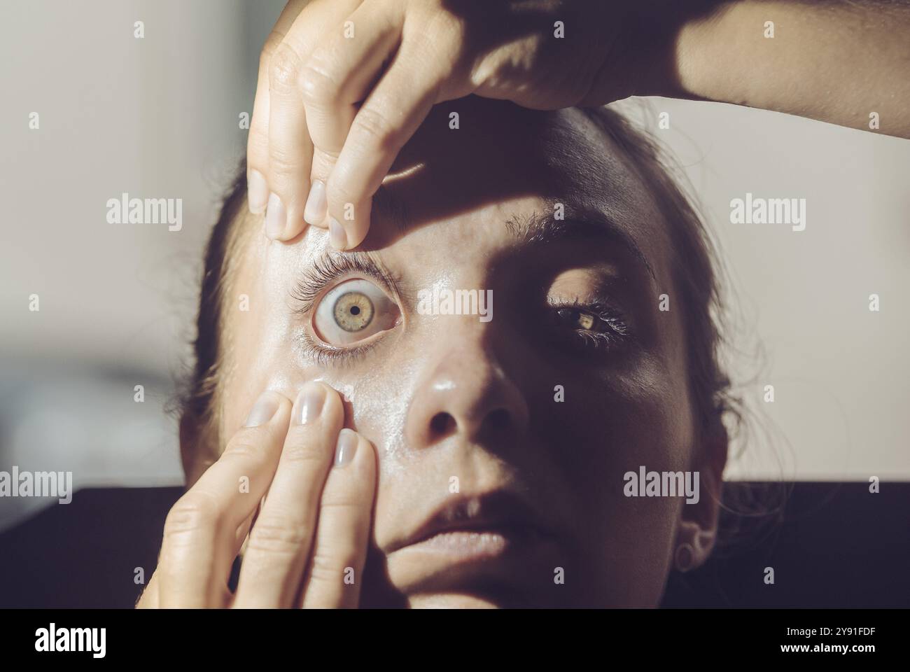 Doctor checking eyes woman eye hi-res stock photography and images - Alamy