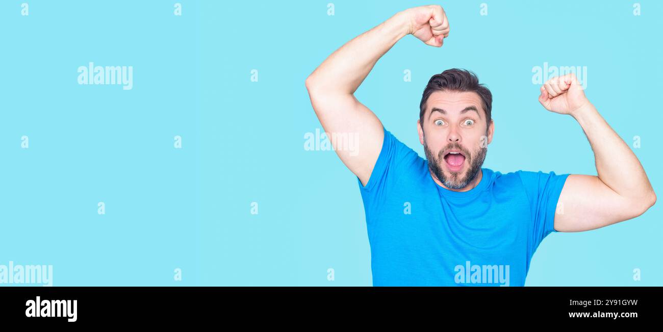 The winner. Successful man raising arms. Excited man with arms up ...