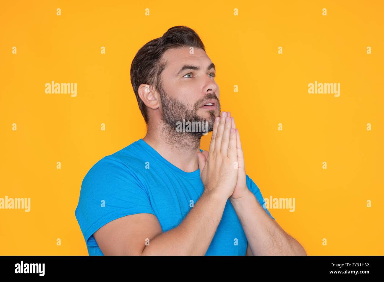 Man praying. Isolated portrait of male pray. Guy thinking intensely ...