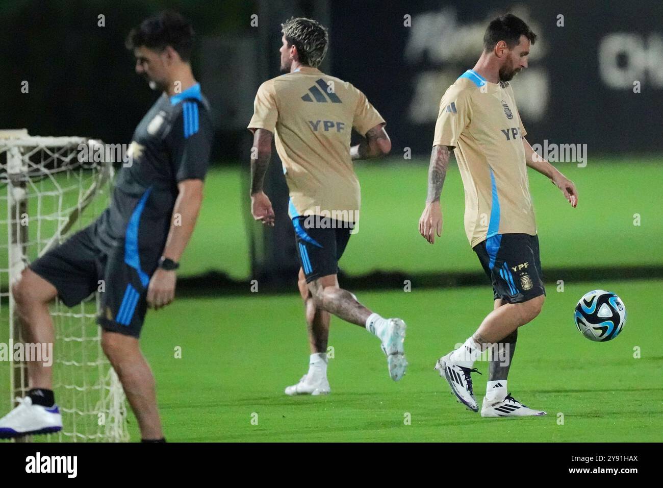 Lionel Messi, of the Argentina national team, right, practices at the ...