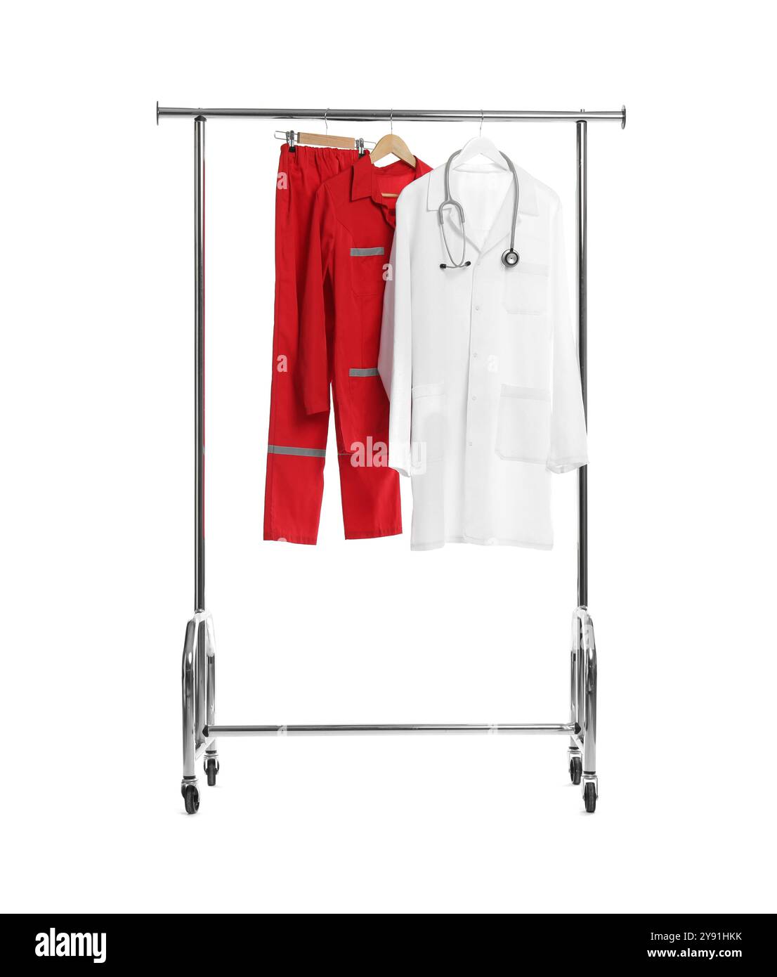 Paramedic uniform and doctor's coat with stethoscope on clothing rack ...