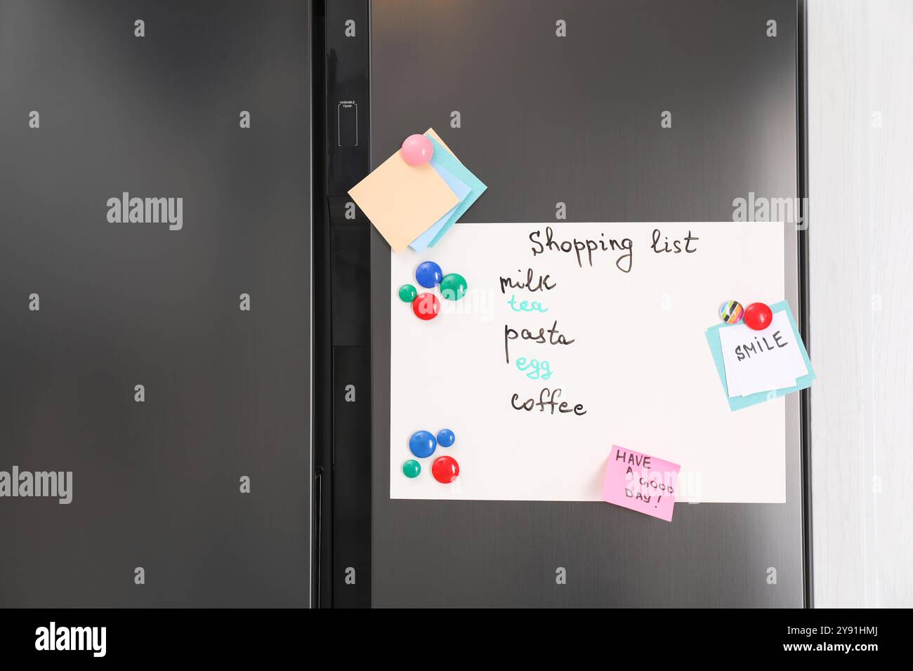 Magnetic board with shopping list and notes on refrigerator Stock Photo ...