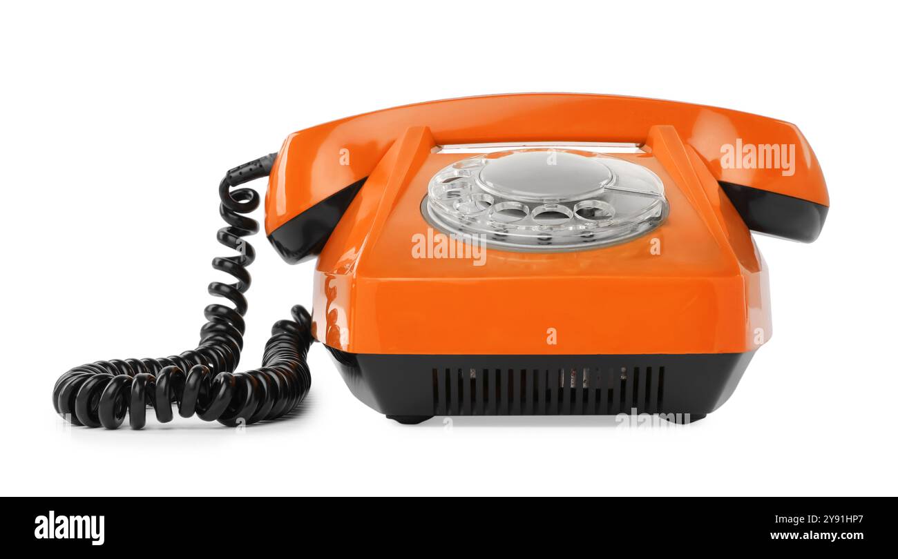 Old orange telephone with rotary dial isolated on white Stock Photo - Alamy