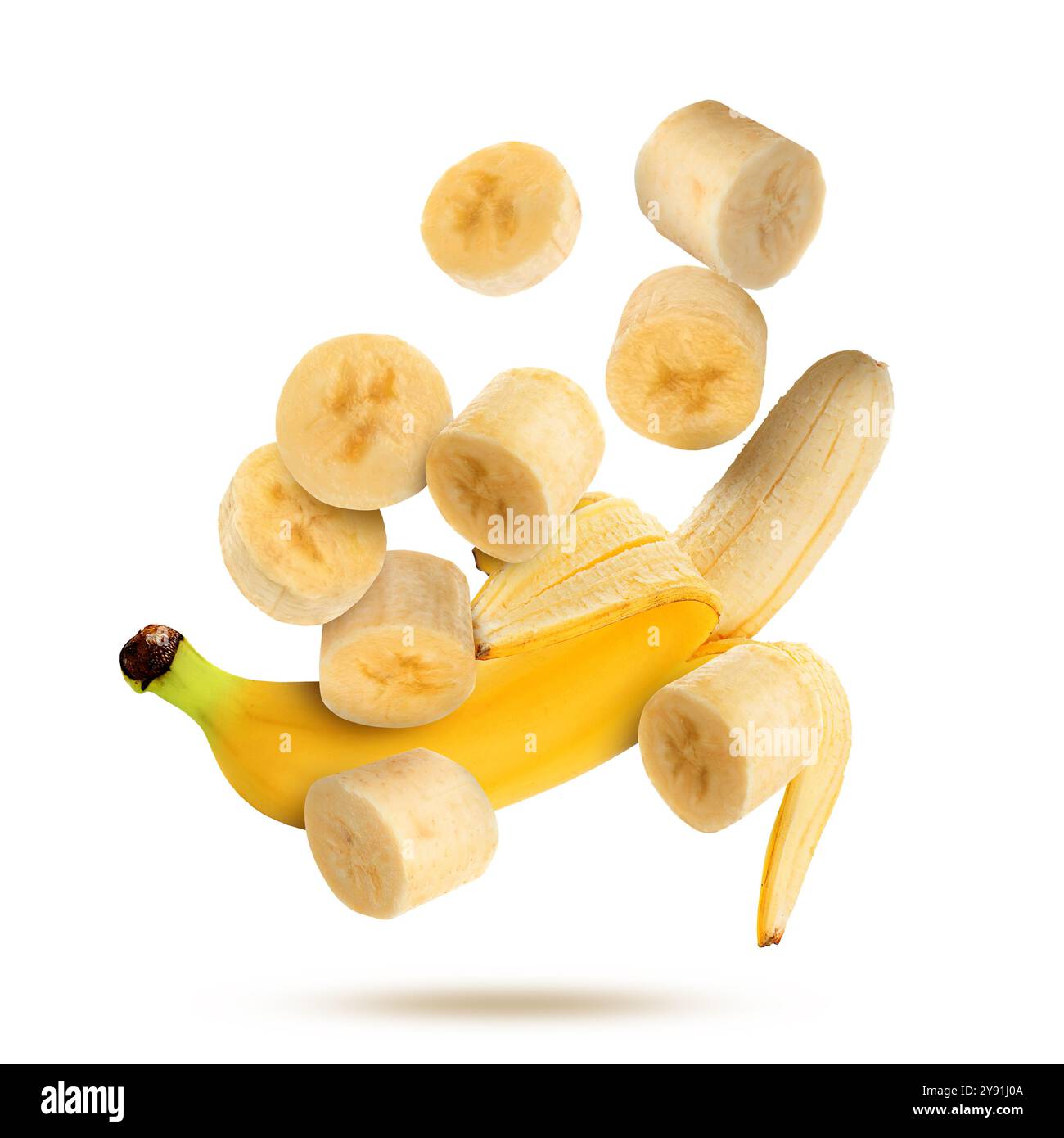 Fresh ripe bananas falling on white background Stock Photo - Alamy