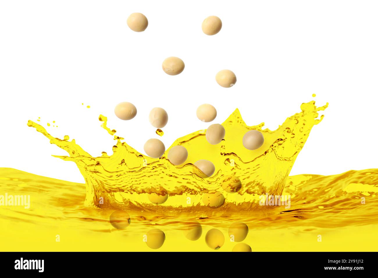 Soy beans falling into vegetable oil on white background Stock Photo ... Soy beans falling into vegetable oil on white background Stock Photo ...