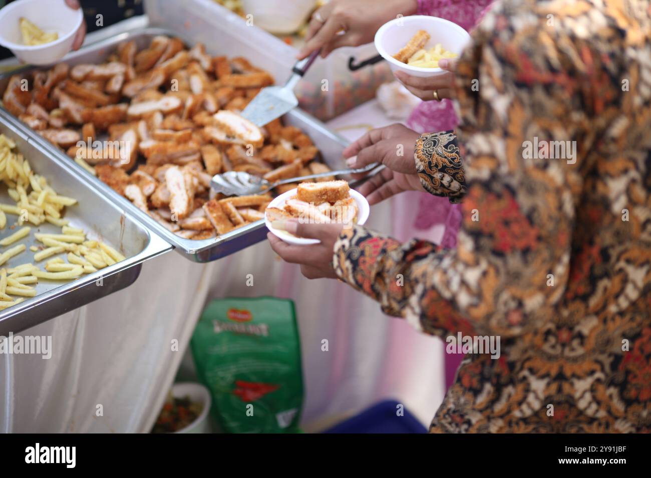 men take fried chicken Stock Photo - Alamy